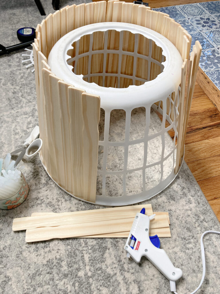 DIY Paint Stick Christmas Tree Collar - Using a Laundry Basket